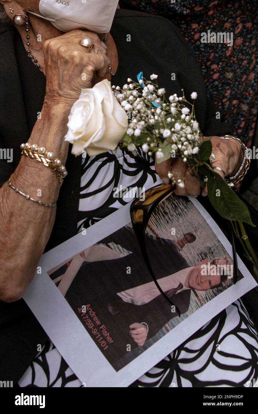 Maria Fisher, mother of Andrew Fisher, holds her son's picture while ...