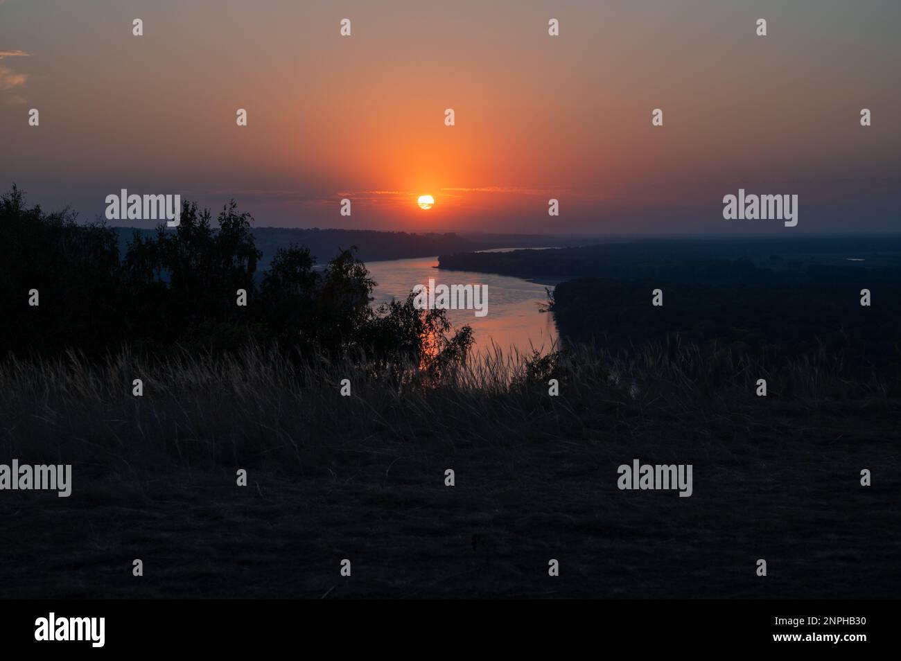 Aerial view of sunset river. Drone flying over the river at dawn with ...