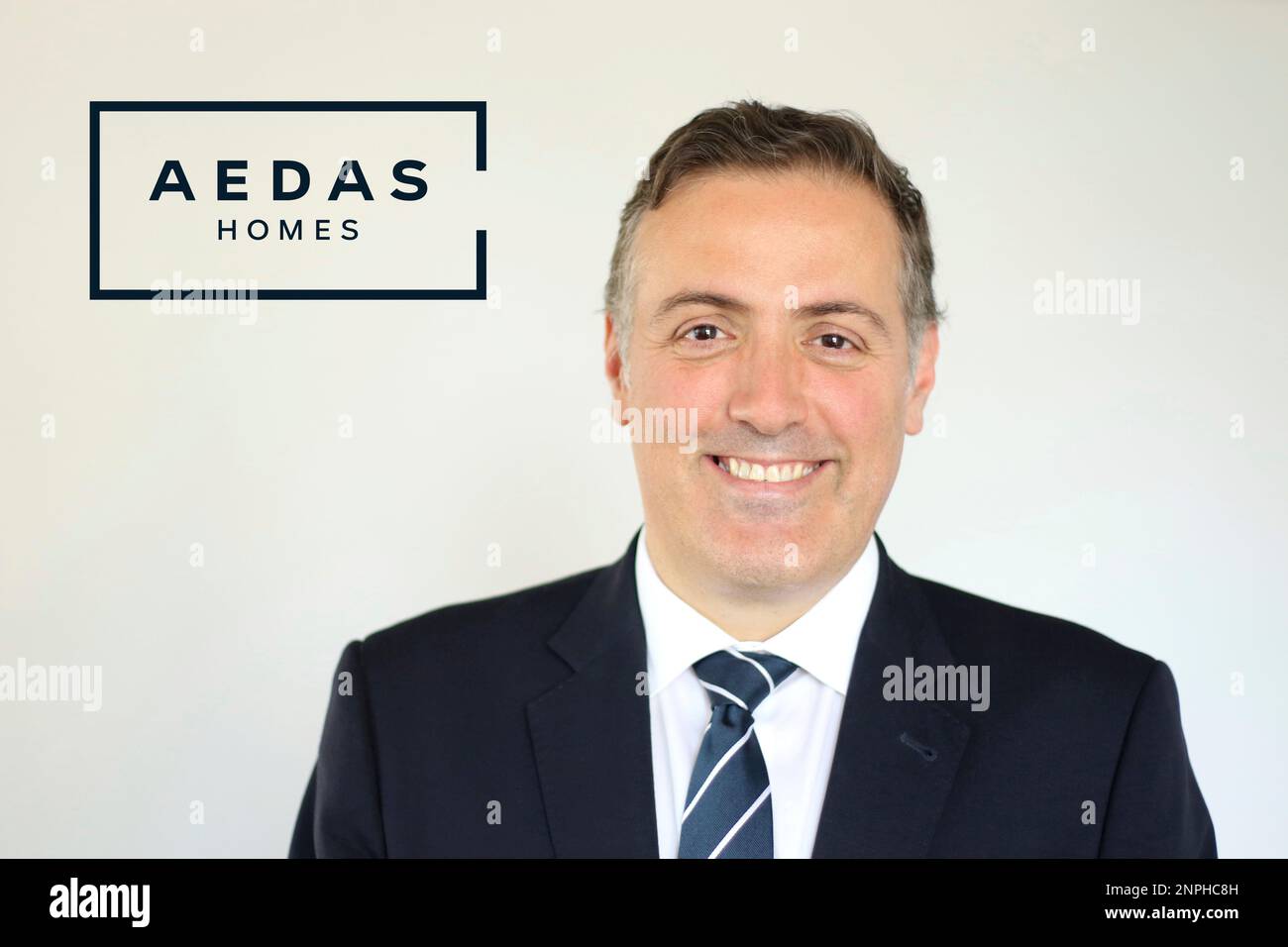 The CEO of AEDAS Homes, David Martinez, poses in front of the company ...
