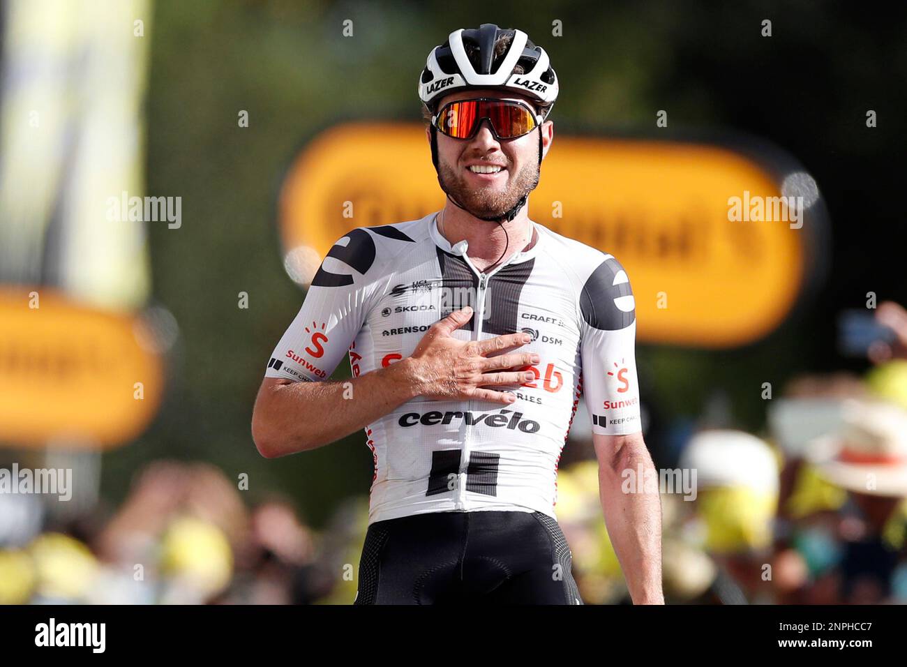 Switzerland's Marc Hirschi celebrates as he crosses the finish line to ...