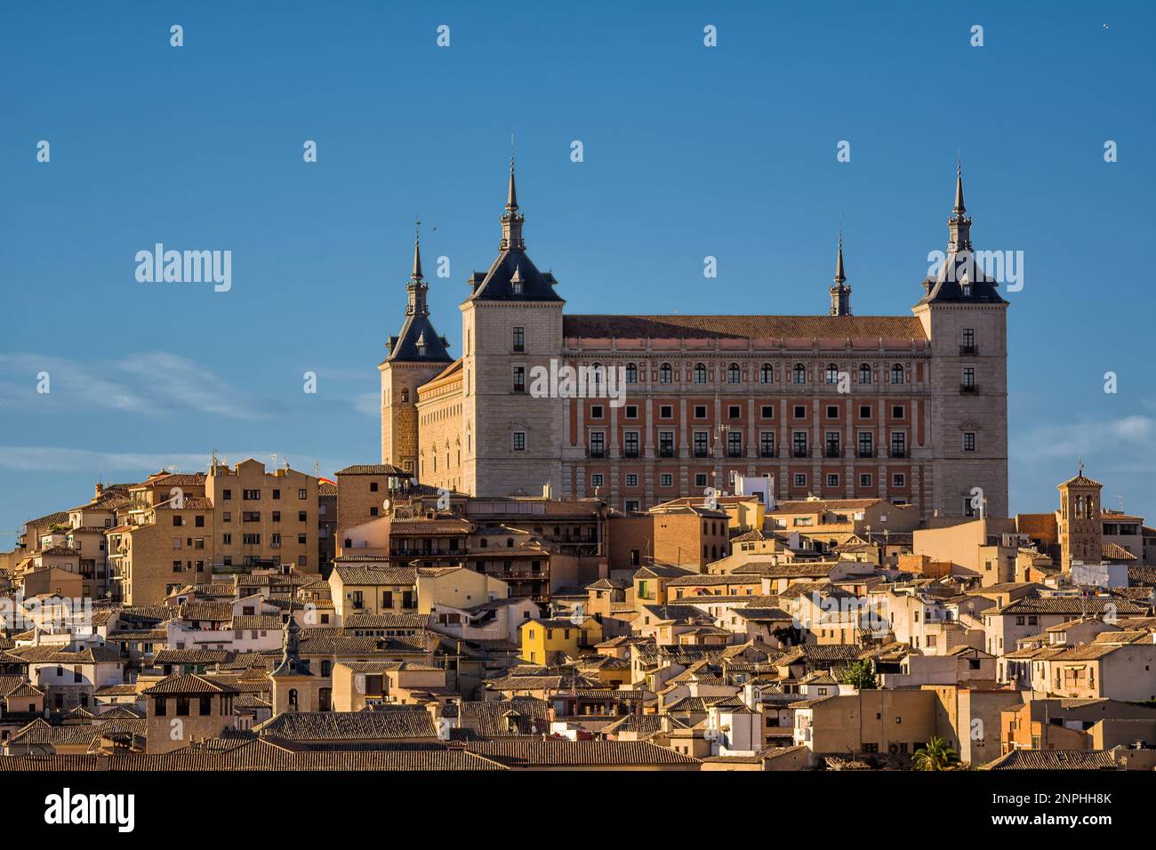 Alcazar of Toledo above the houses of the old area Stock Photo - Alamy
