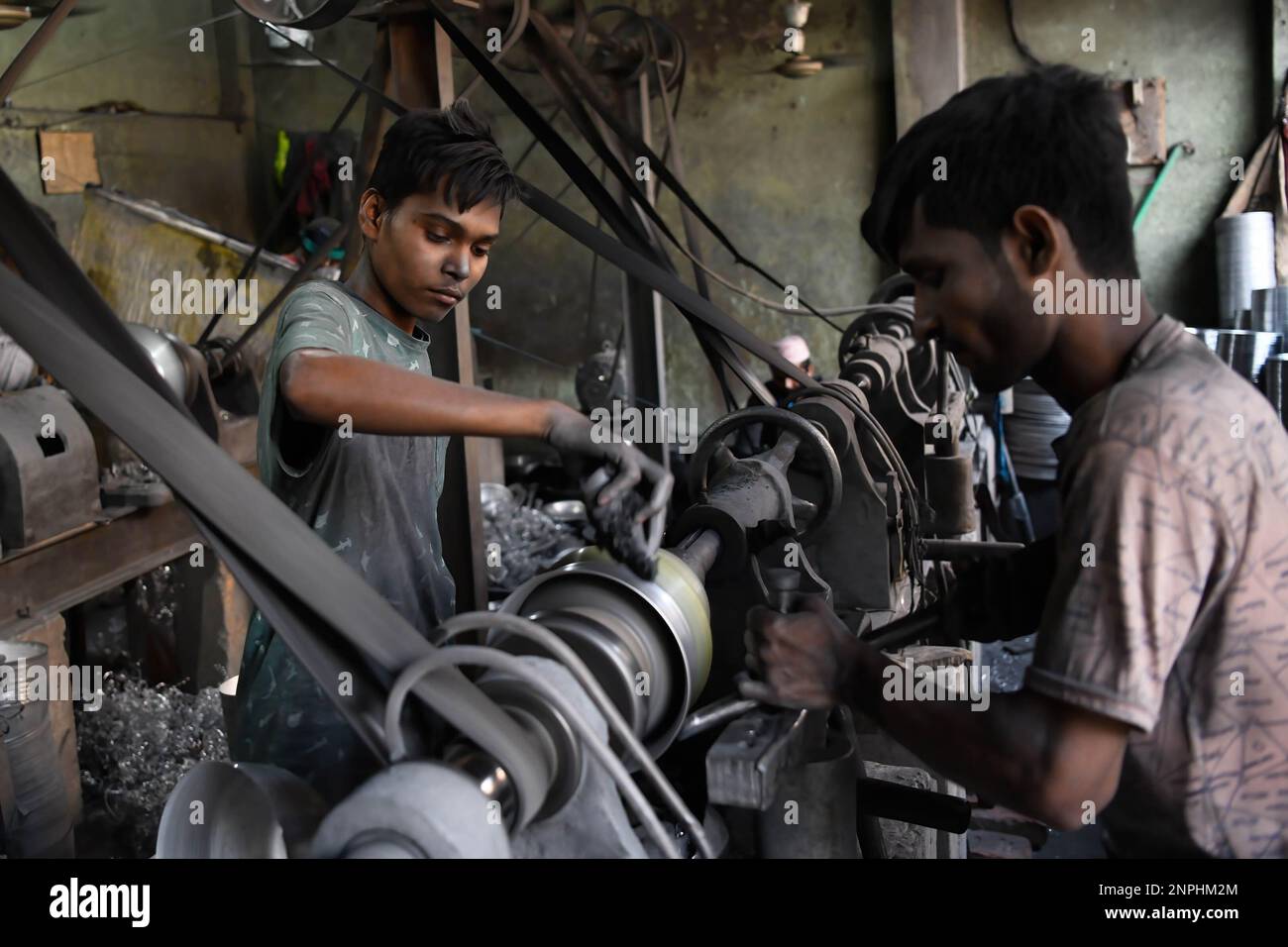 Teenage boys are seen working at an aluminum factory in Dhaka. Aluminum ...