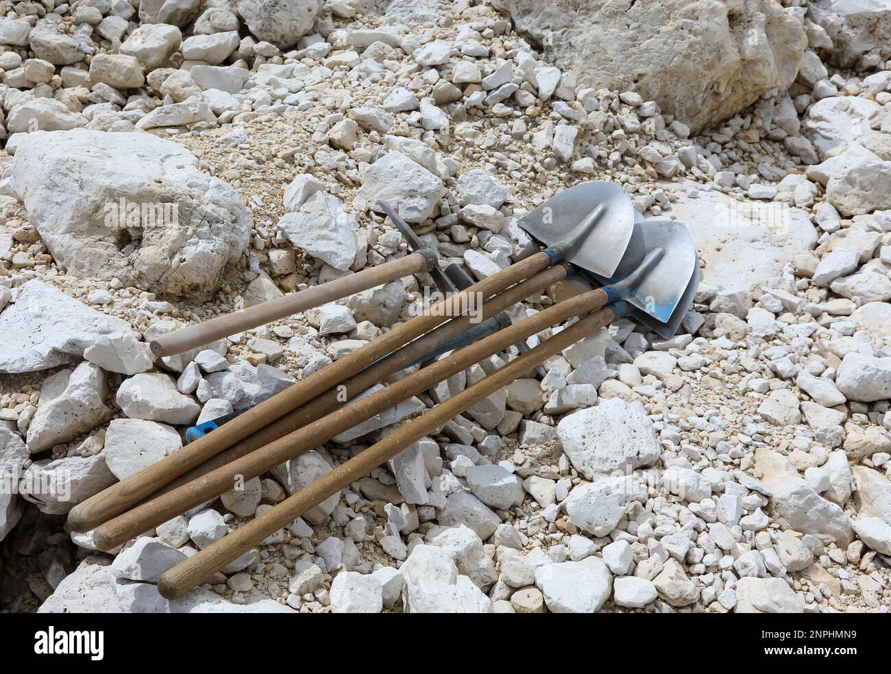 spades and shovels abandoned by the workers during the break from the ...