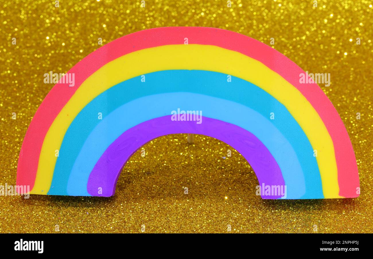 rainbow arc with many colors and golden glitter background Stock Photo ...