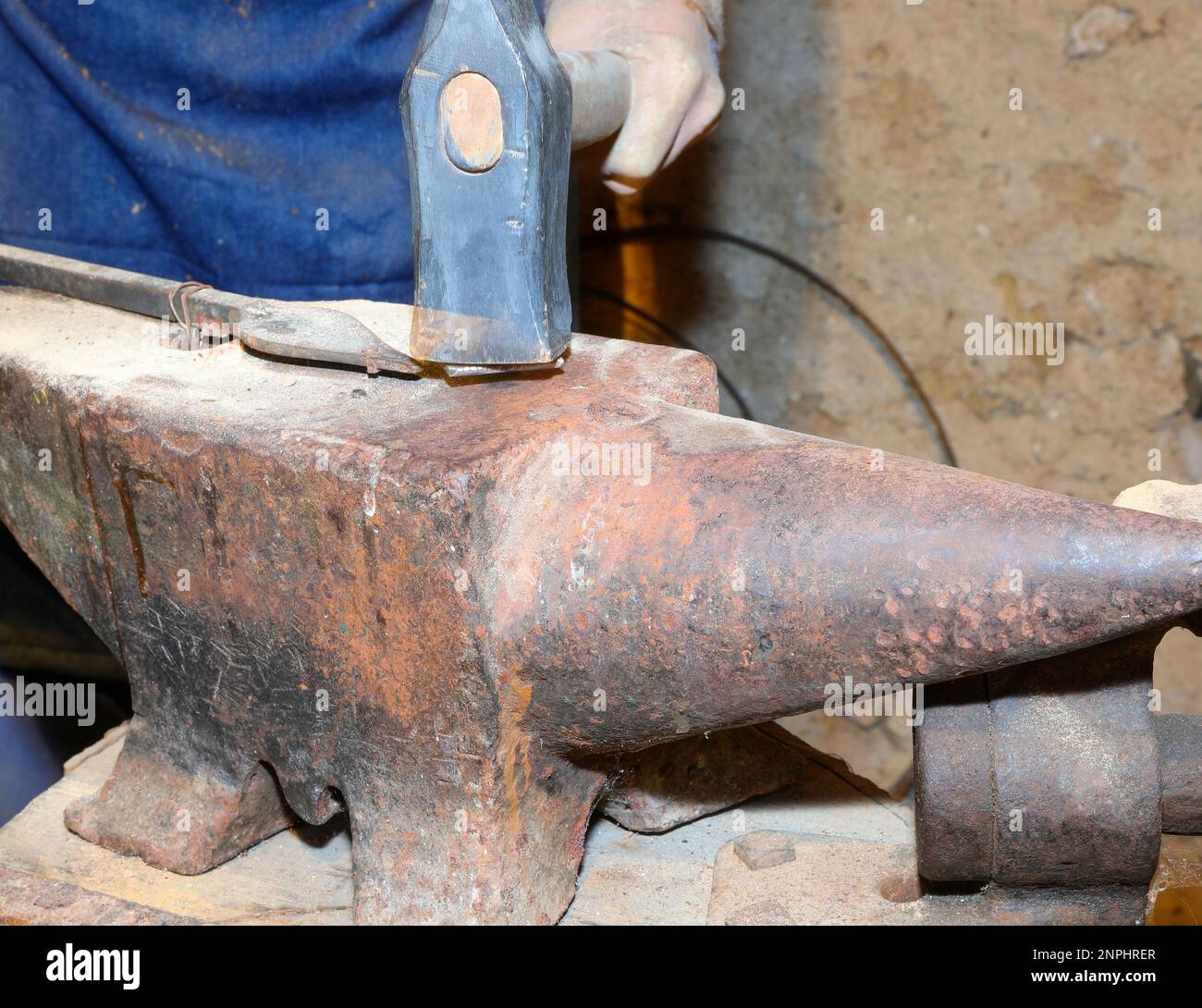 iron anvil and the hammer that seems to move in the blacksmith s ...