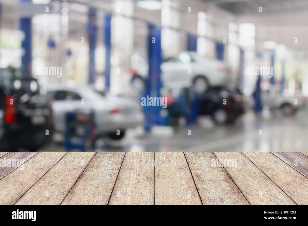 Wood table top with blur garage background, for product display or ...