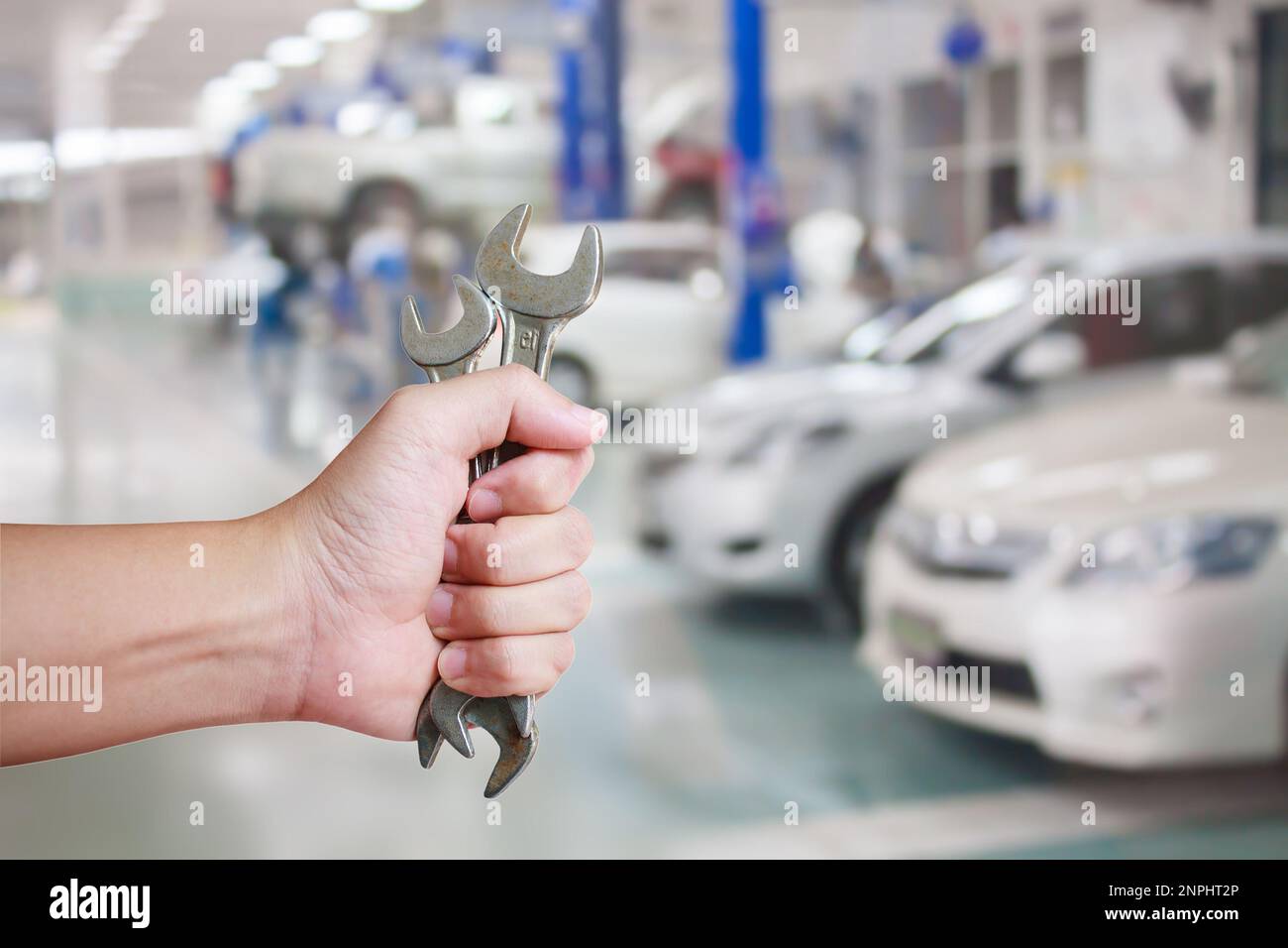 Hand of professional Auto mechanic with wrench, Auto repair service ...