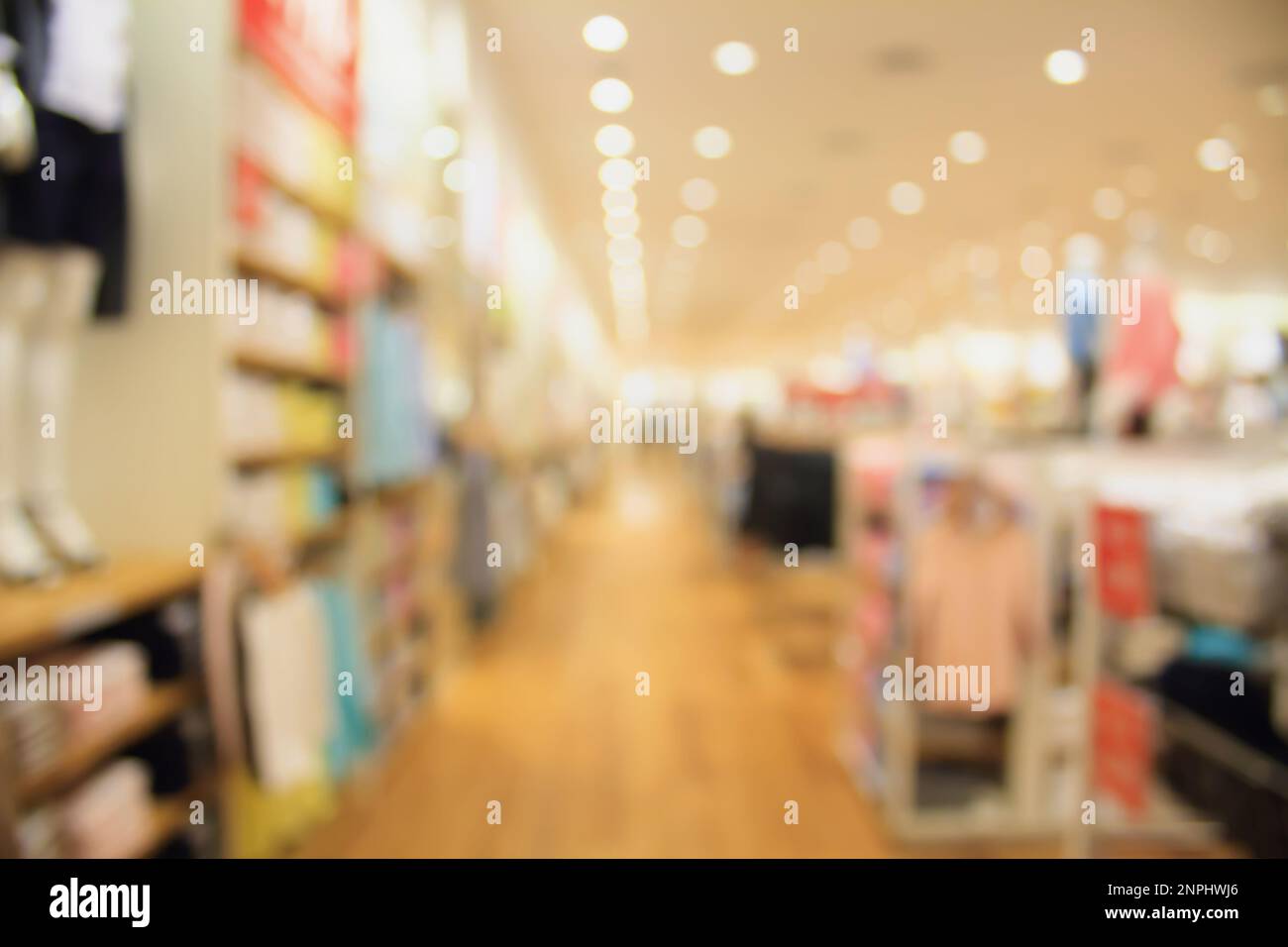 clothing boutique store interior blurred background Stock Photo - Alamy