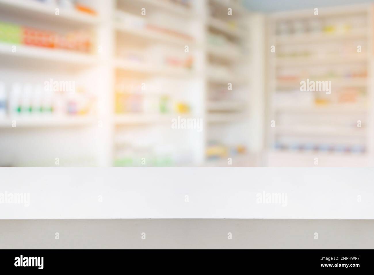 wood counter with blur shelves of drug in the pharmacy drugstore ...