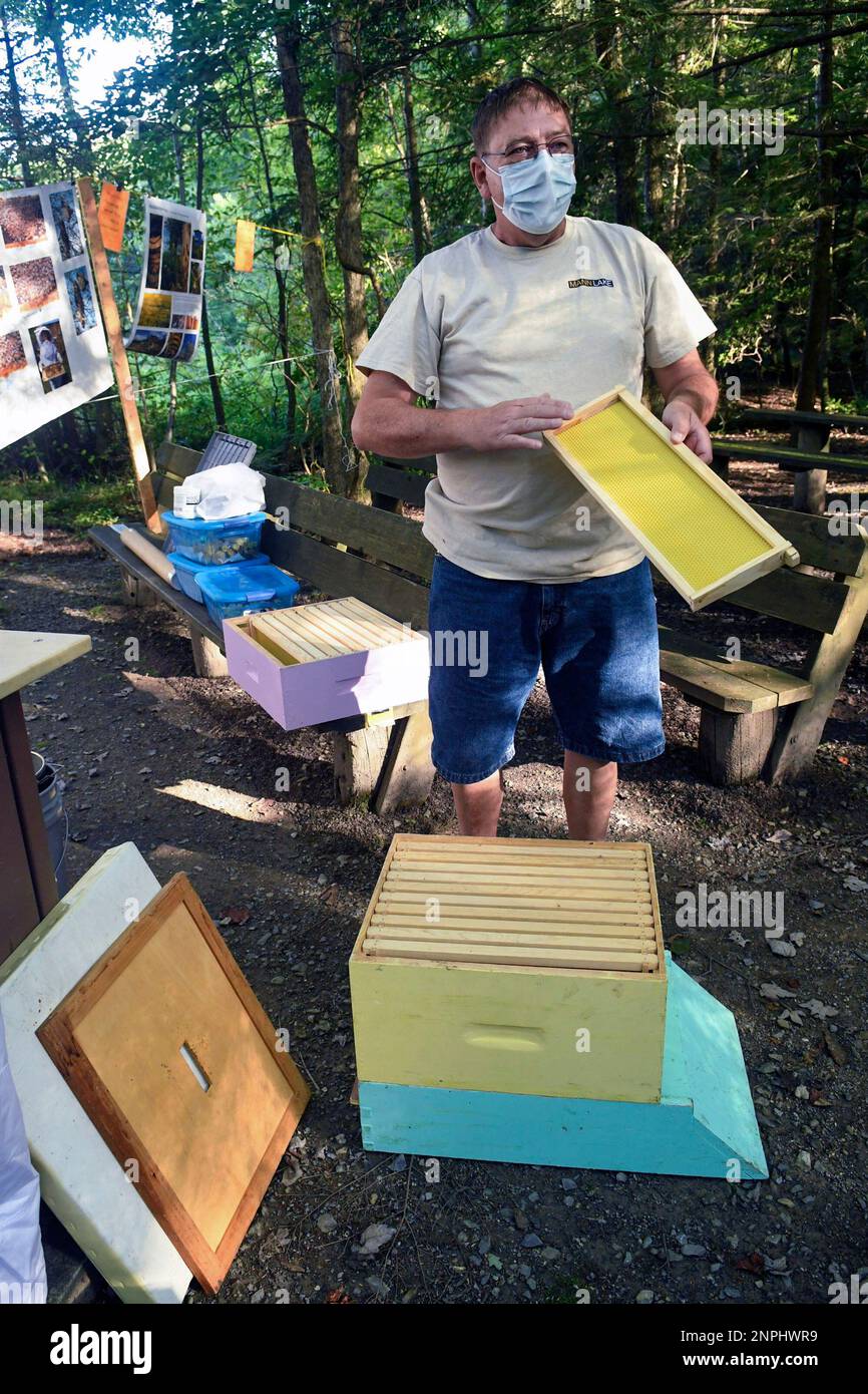 Beekeeper Robert Reed, of Tamaqua, shows the wooden frames and parts of ...