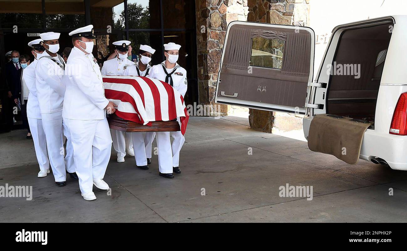 U.S. Navy pallbearers carry a casket containing the remains of F1C ...