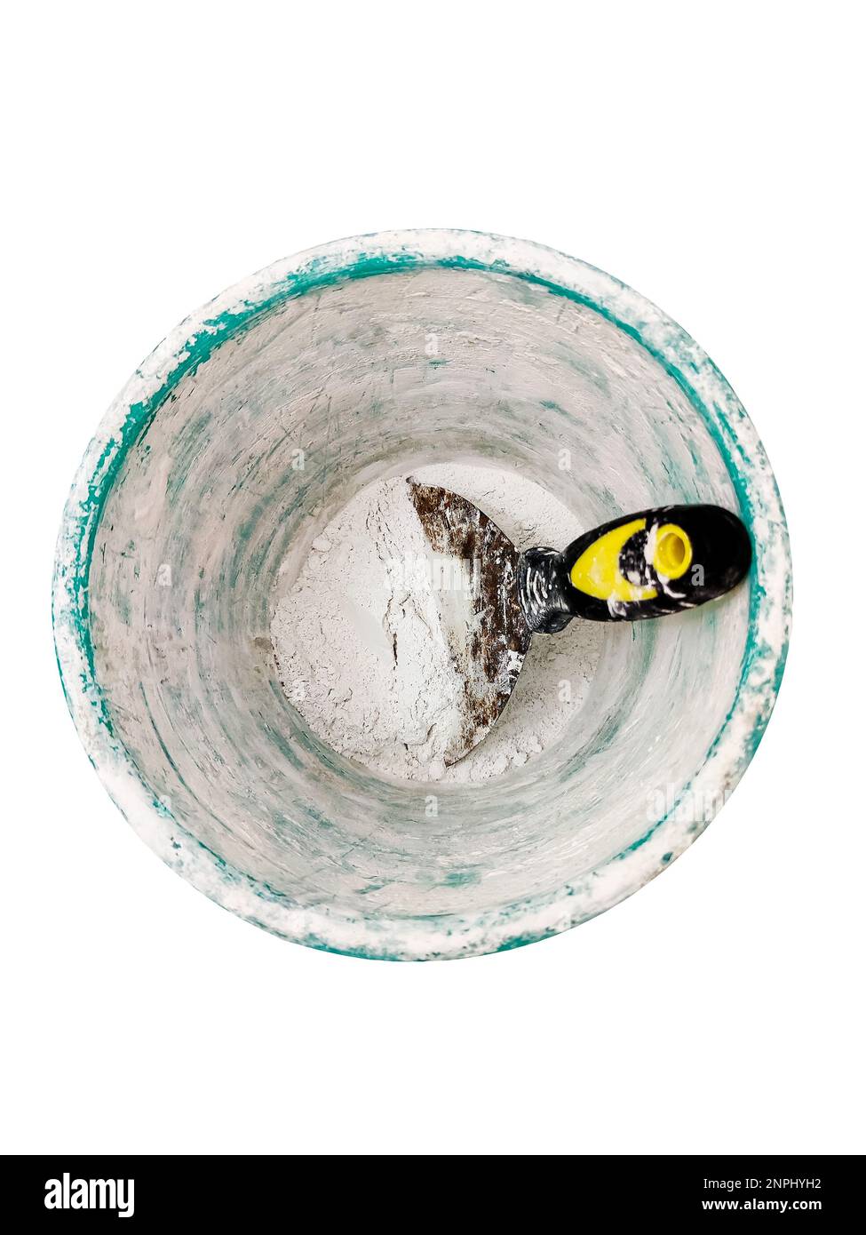 Spatula is placed inside an old plastic bucket. Process of manual ...