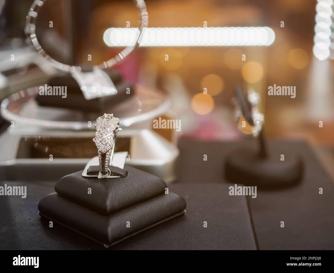 Diamond rings with blank price tag show in jewelry luxury store window ...