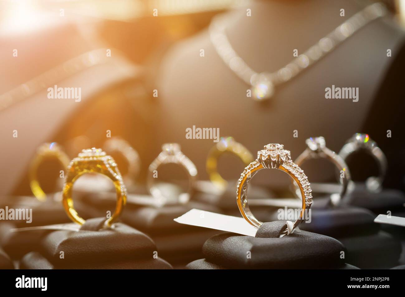 Jewelry diamond rings and necklaces show in luxury retail store window ...