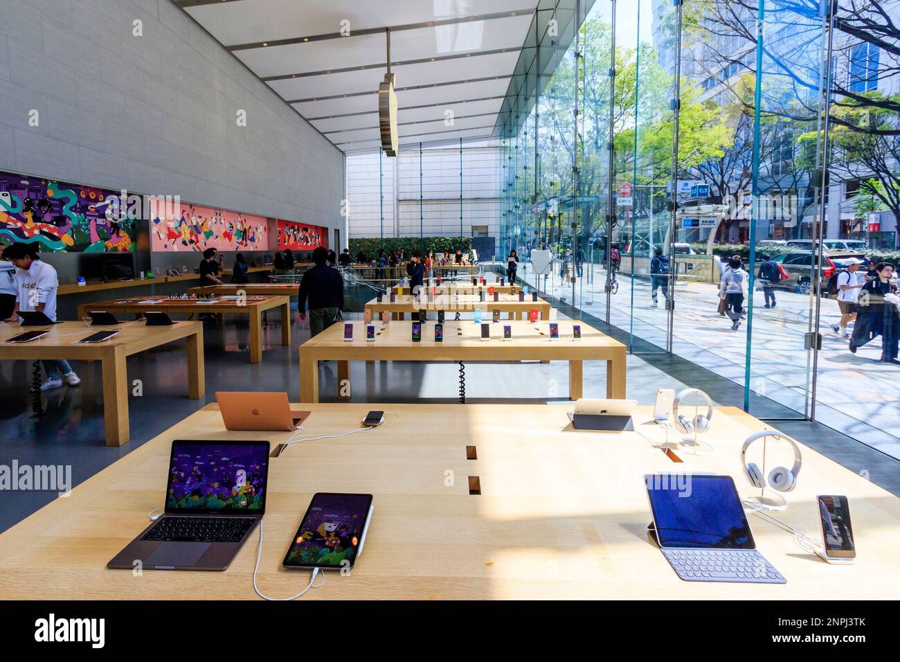 Interior of the Apple store in Omotesando, Tokyo. People looking at the ...