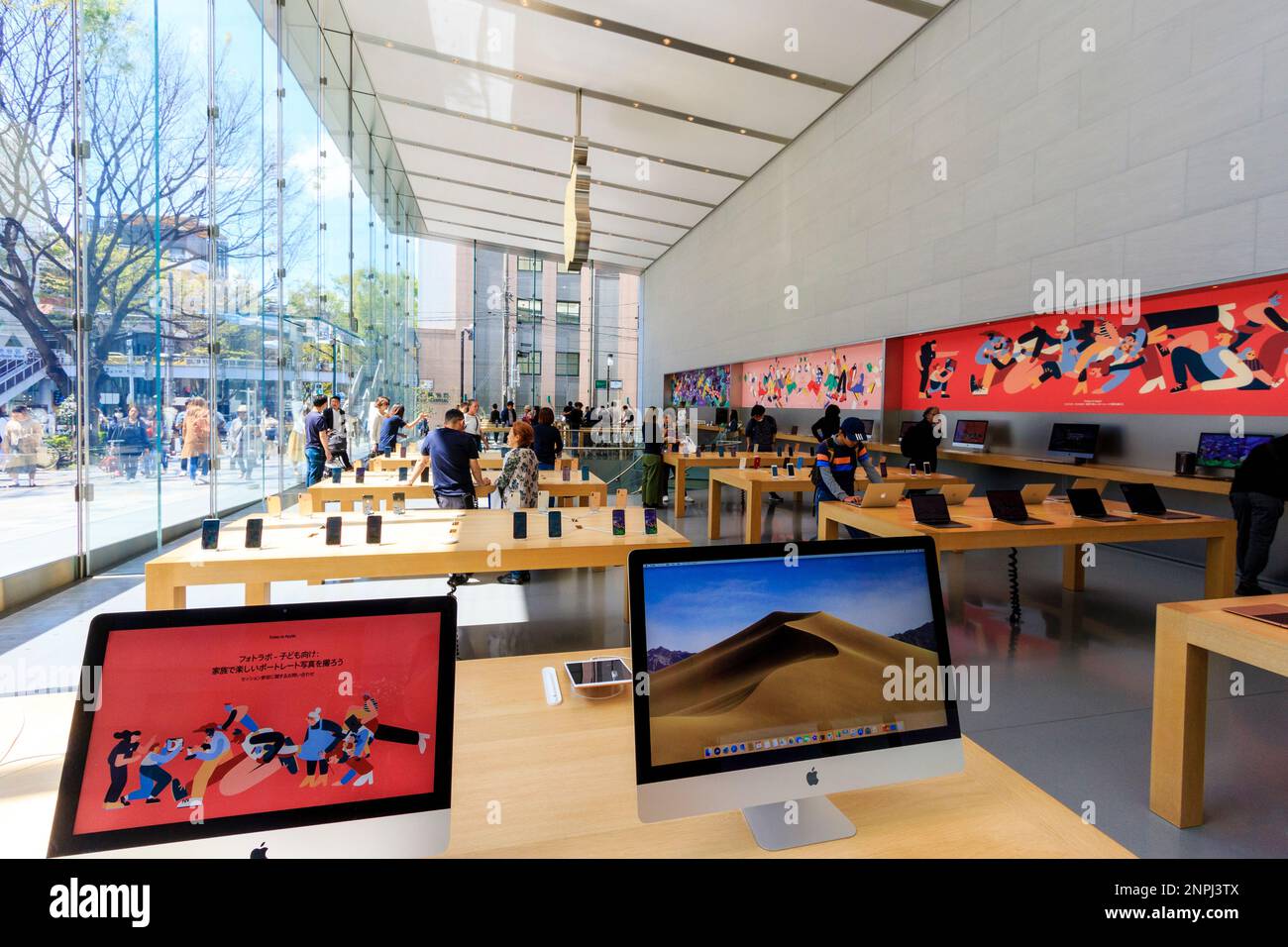 Interior of the Apple store in Omotesando, Tokyo. People looking at the ...