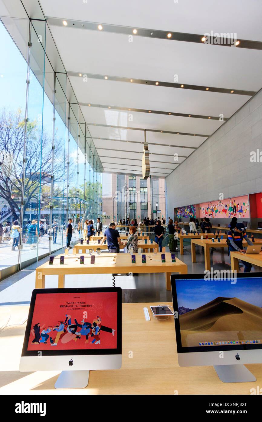 Interior of the Apple store in Omotesando, Tokyo. People looking at the ...