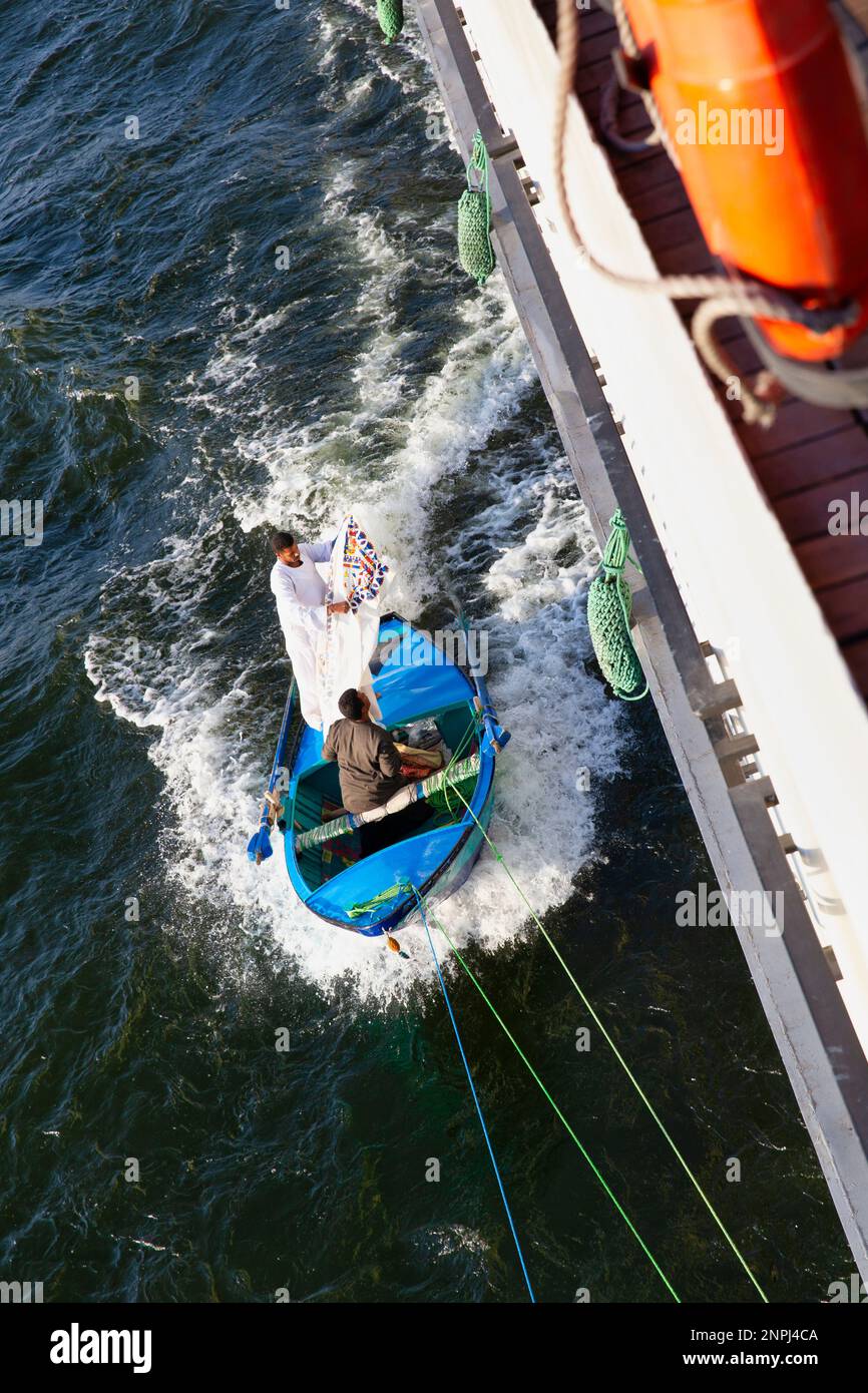 Traders selling to Cruise Ship on River Nile Stock Photo - Alamy