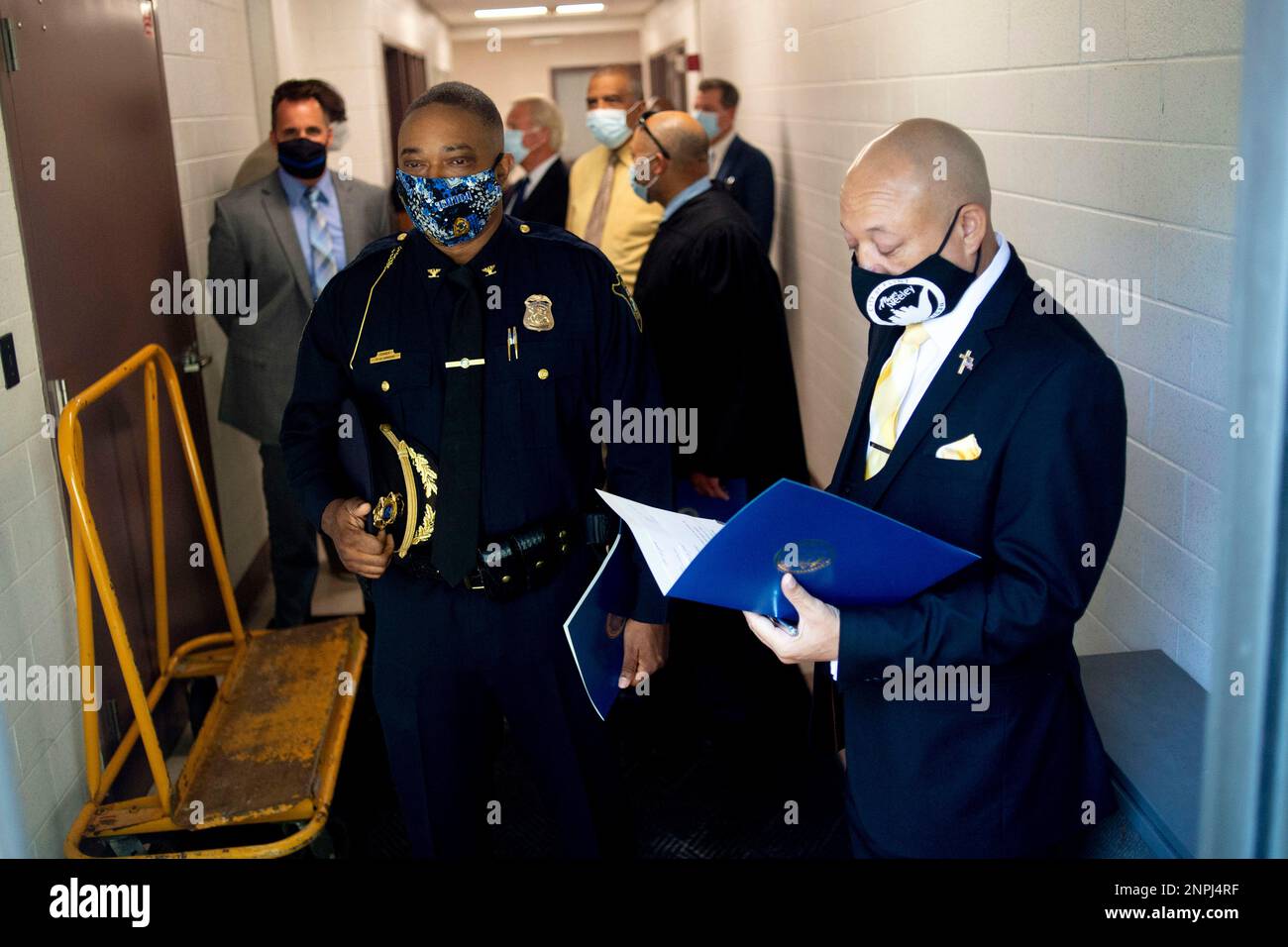 Flint Police Chief Terence Green, center left, stands alongside Flint ...