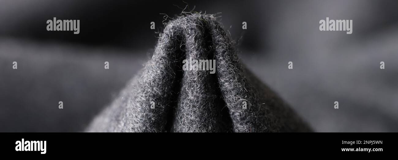 Dark gray woolen fabric in form of cone Stock Photo - Alamy