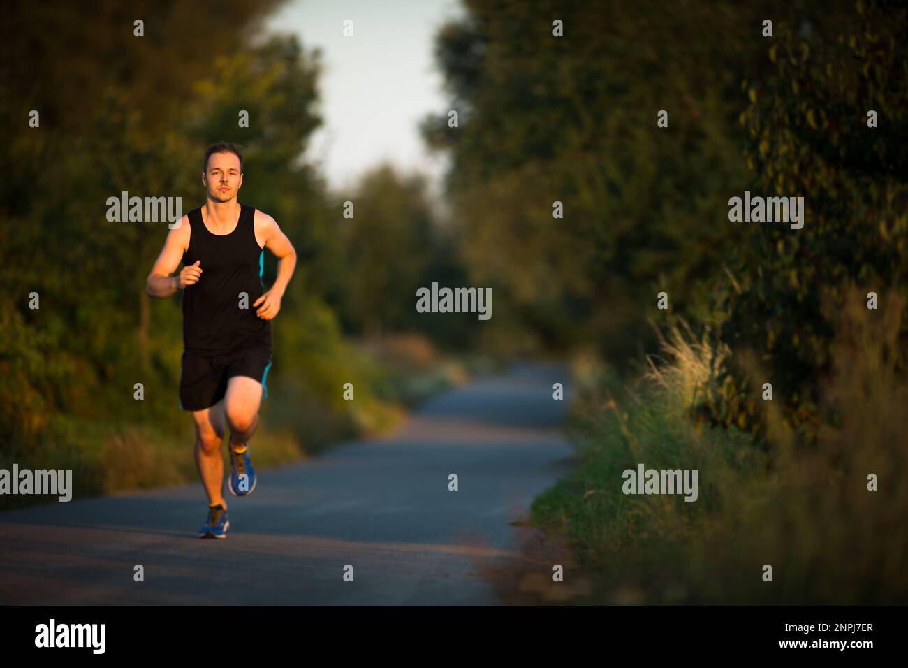 Shot of a young male athlete training. Getting his daily dose of ...