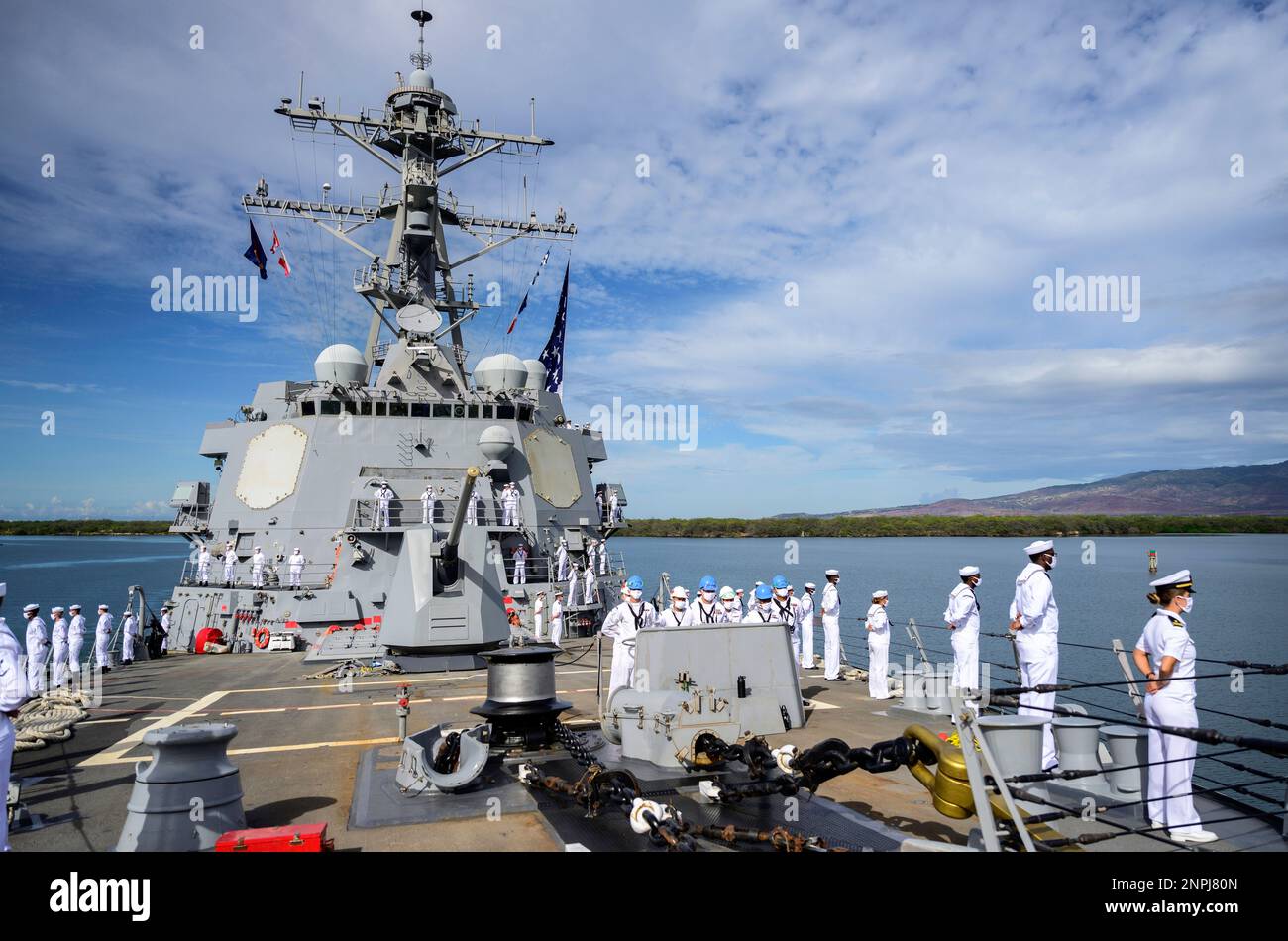 In this image provided by the U.S. Navy, sailors man the rails as the ...
