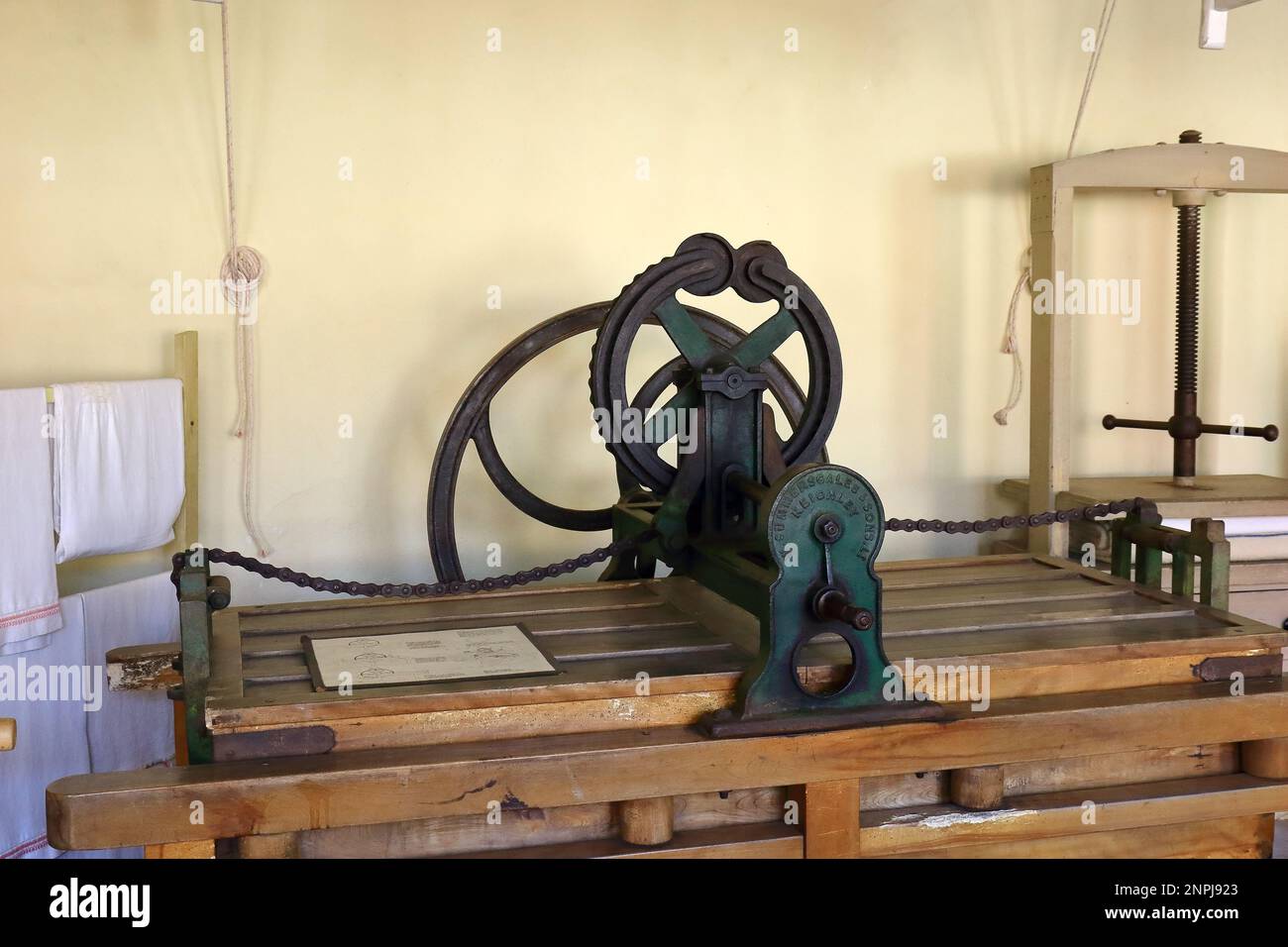 An old mechanical box mangle for drying clothes Stock Photo - Alamy