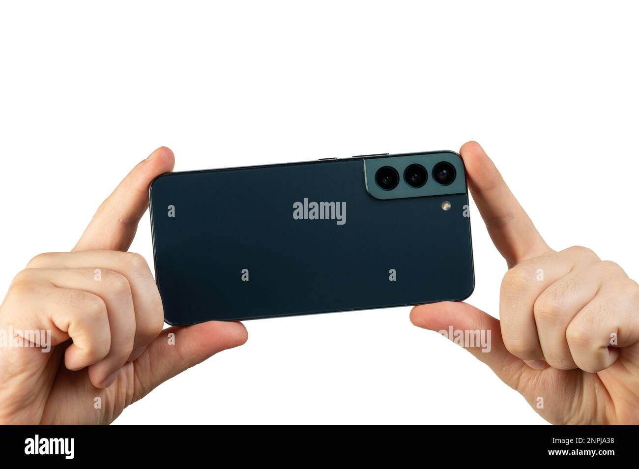 Green smartphone in hands back view isolated on white studio background ...