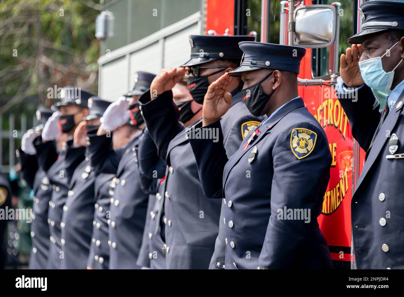Detroit firefighters stand at attention during a memorial for fallen ...