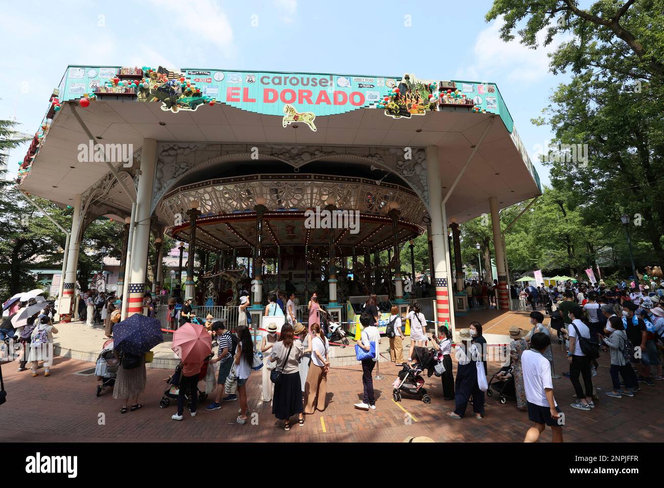 Visitors enjoy riding Carousel El Dorado at Toshimaen amusement park, in Nerima Ward, Tokyo on ...
