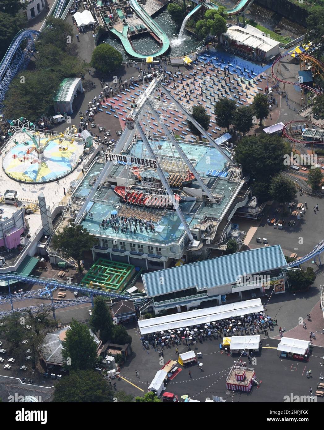 An aerial photo shows facilities such as a swimming pool, merry-go ...