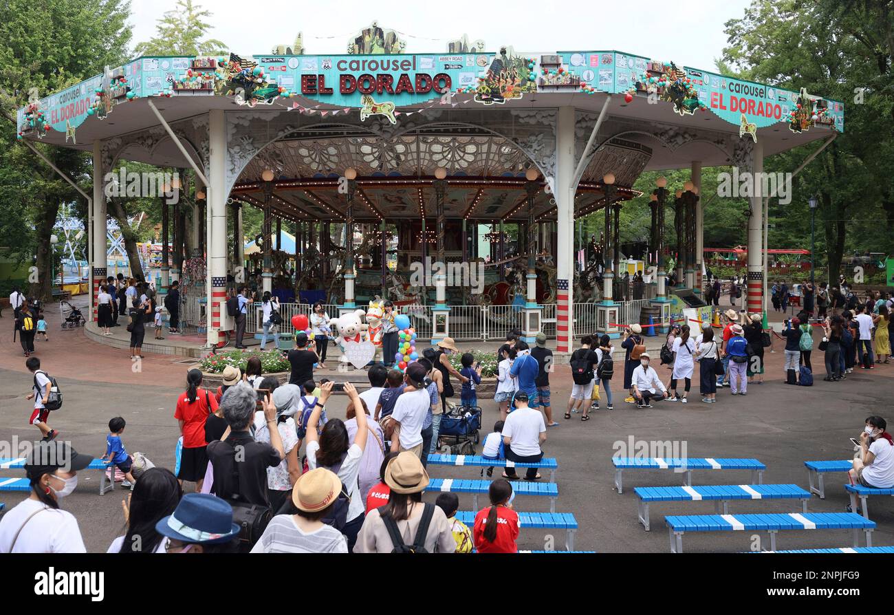 Visitors enjoy riding Carousel El Dorado at Toshimaen amusement park, in Nerima Ward, Tokyo on ...
