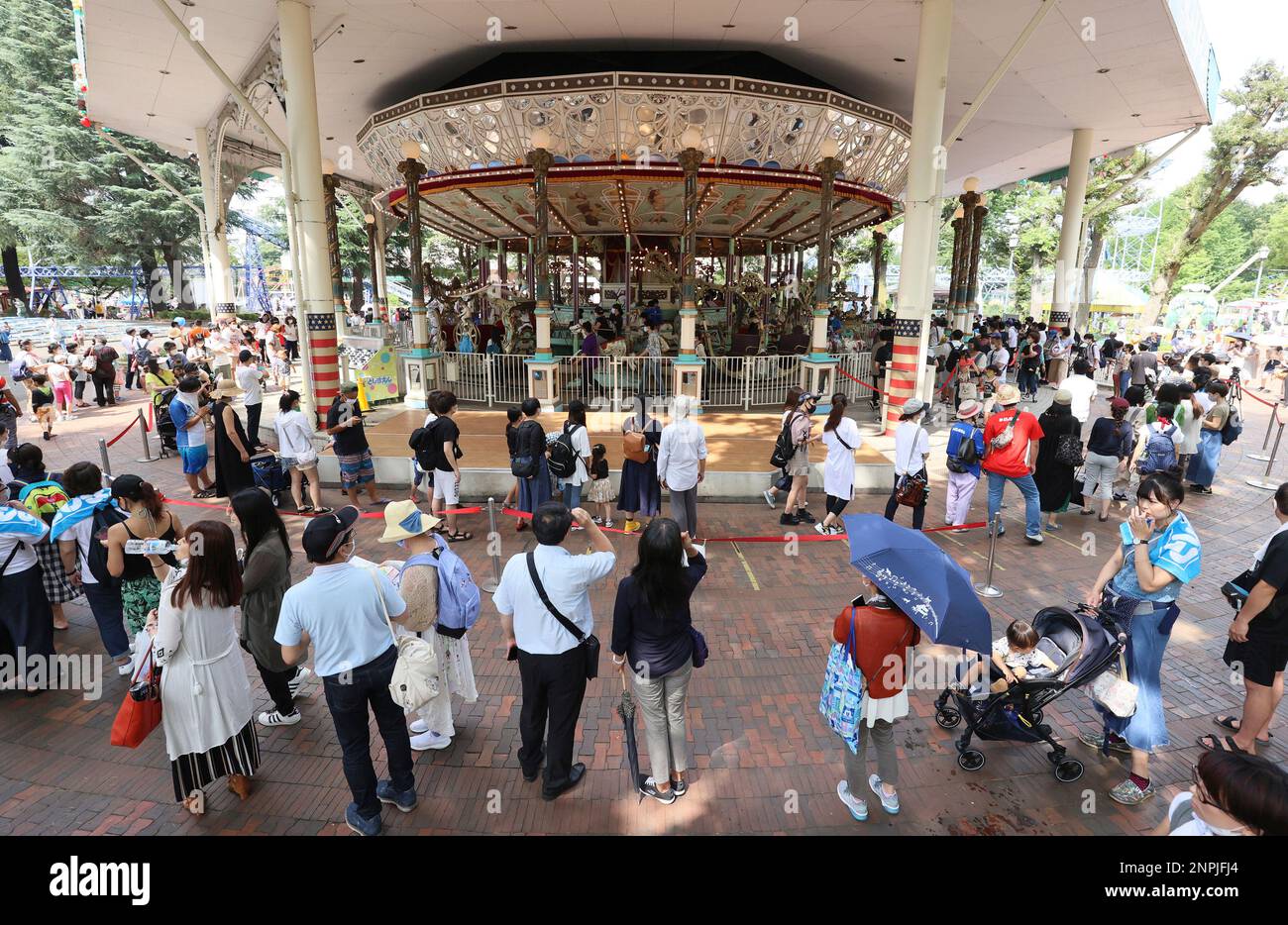 Visitors enjoy riding Carousel El Dorado at Toshimaen amusement park, in Nerima Ward, Tokyo on ...