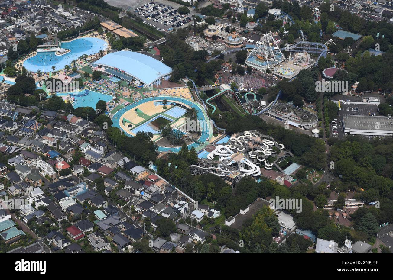 An aerial photo shows facilities such as a swimming pool, merry-go ...