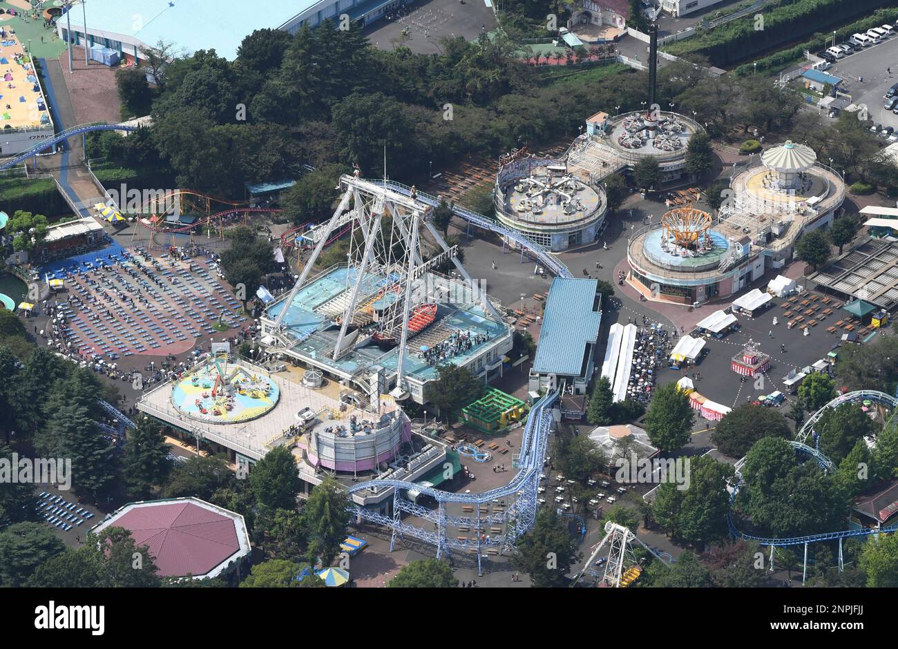 An aerial photo shows facilities such as a swimming pool, merry-go ...