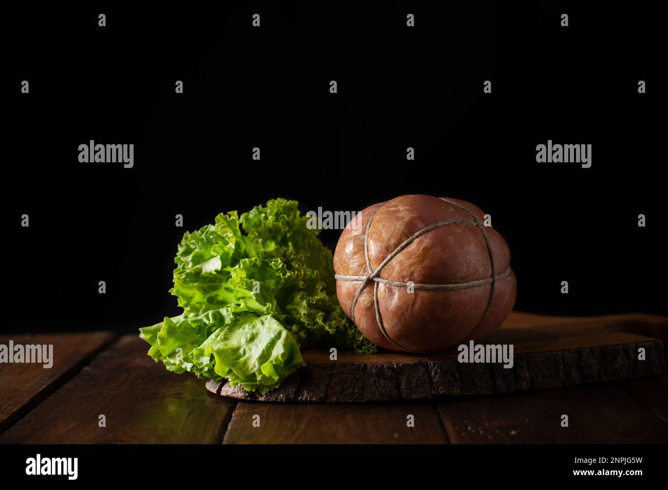 Mortadella. Traditional pork sausage with pistachios or black pepper ...