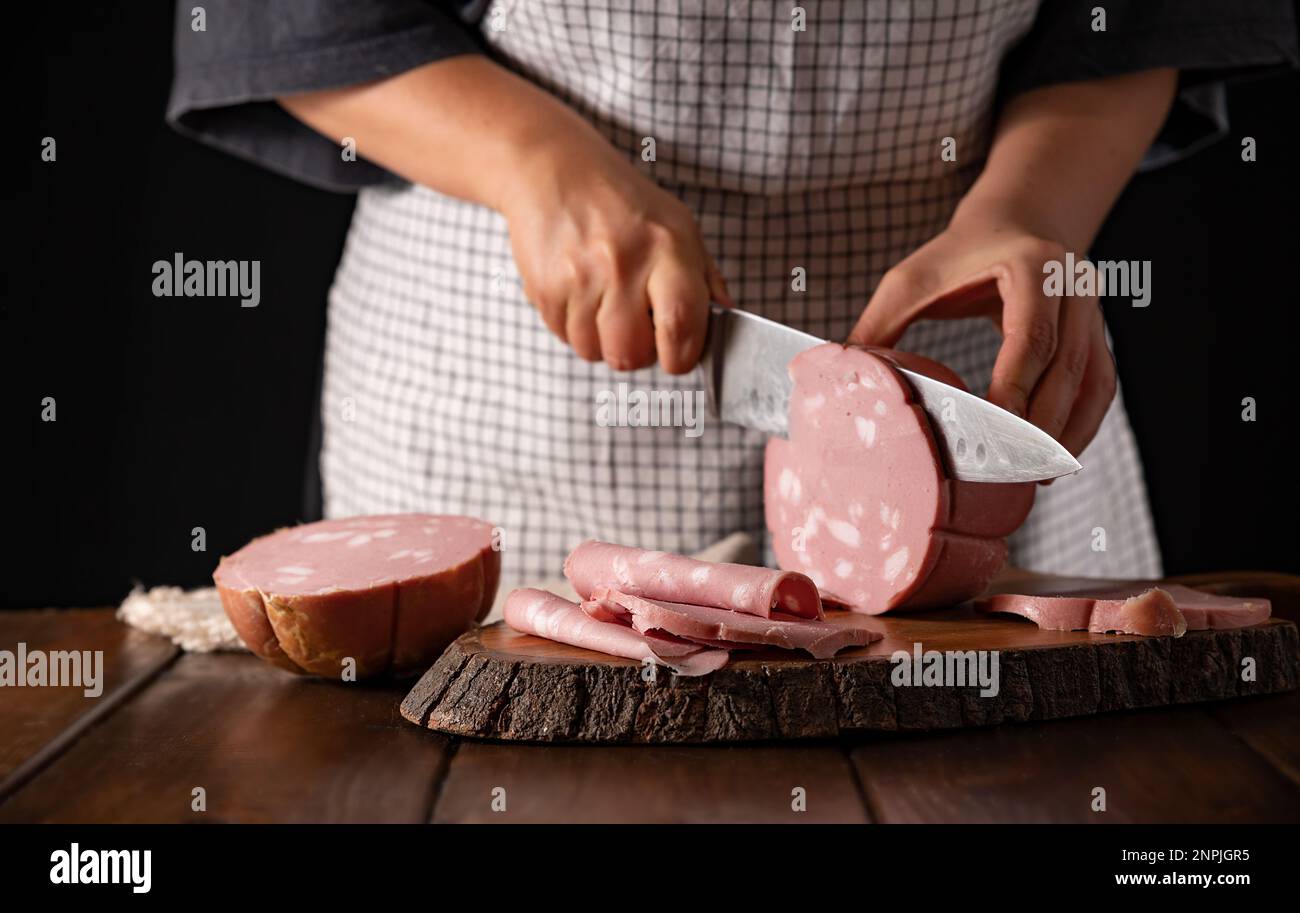 Mortadella. Traditional pork sausage with pistachios or black pepper ...