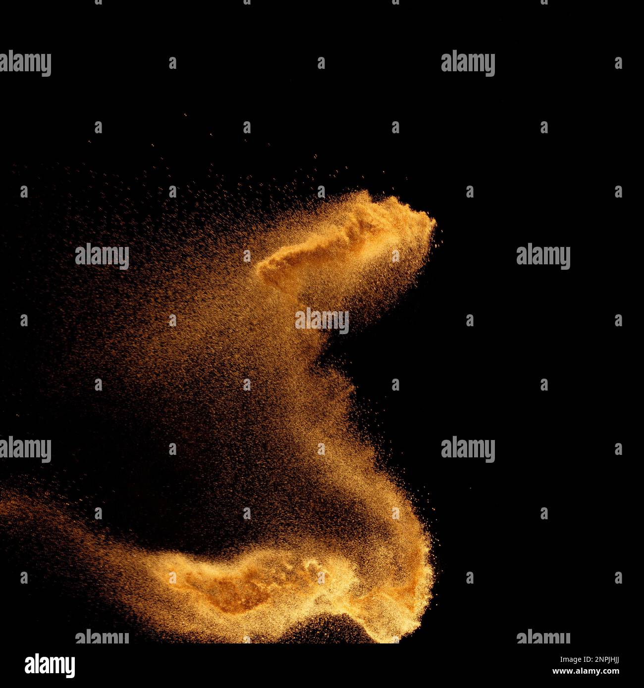 Golden sand explosion isolated on black background. Colored sand splash ...