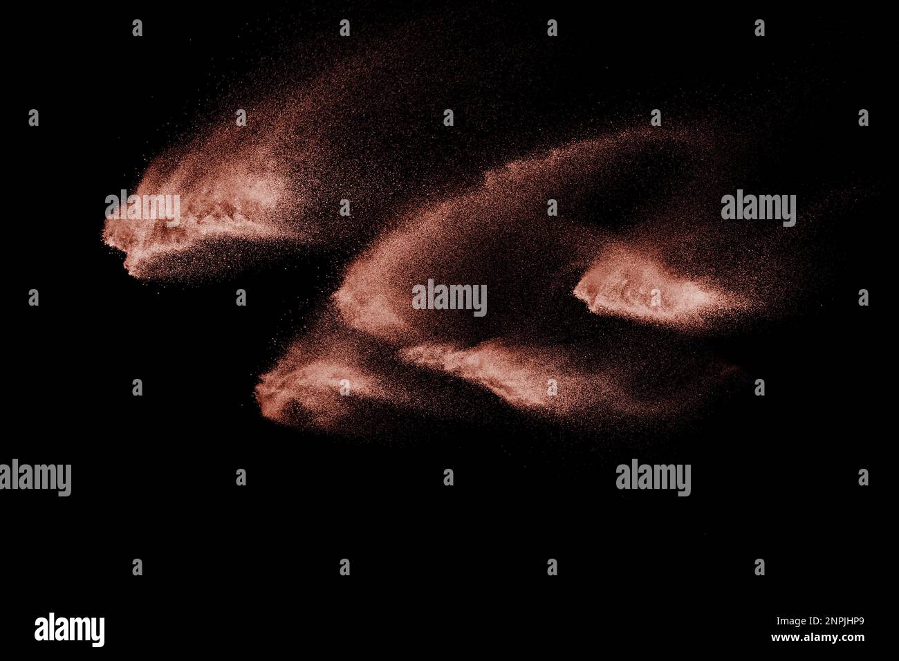 Brown color sand splash against black background. Sand fly wave in the ...