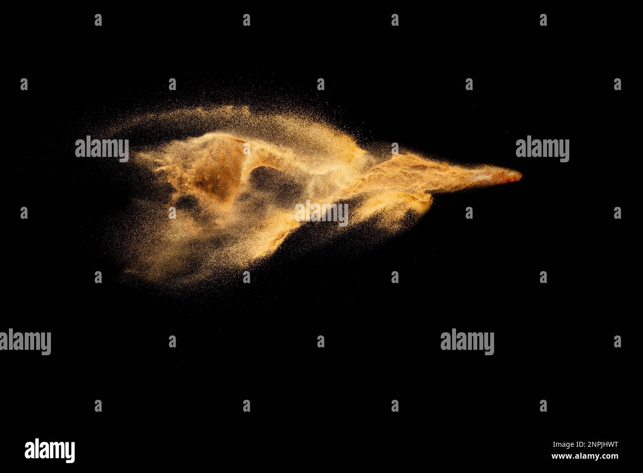 Golden sand explosion isolated on black background. Colored sand splash ...