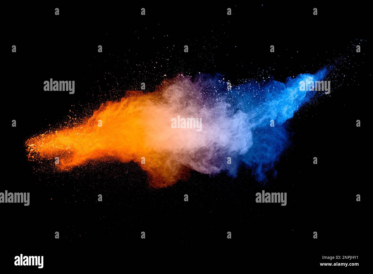 Blue orange color powder explosion cloud on black background. Closeup ...