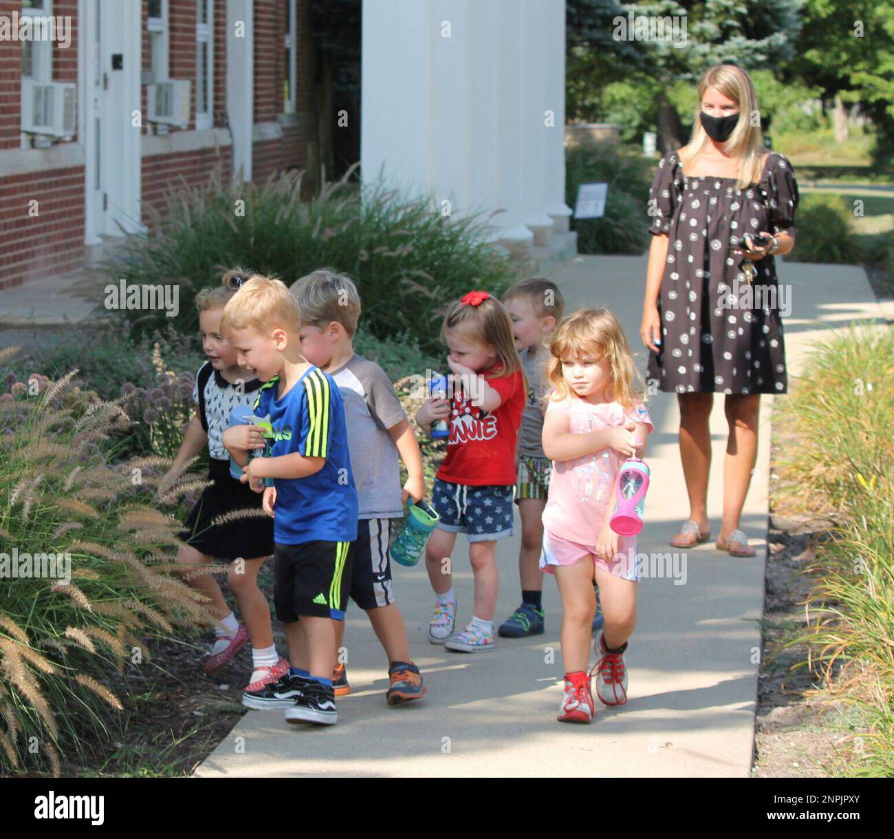 Principal Natasha Magnuson looks on as the preschoolers take a nature ...