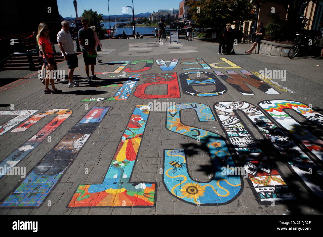 People look at the More Justice More Peace Mural created by 17 artists ...
