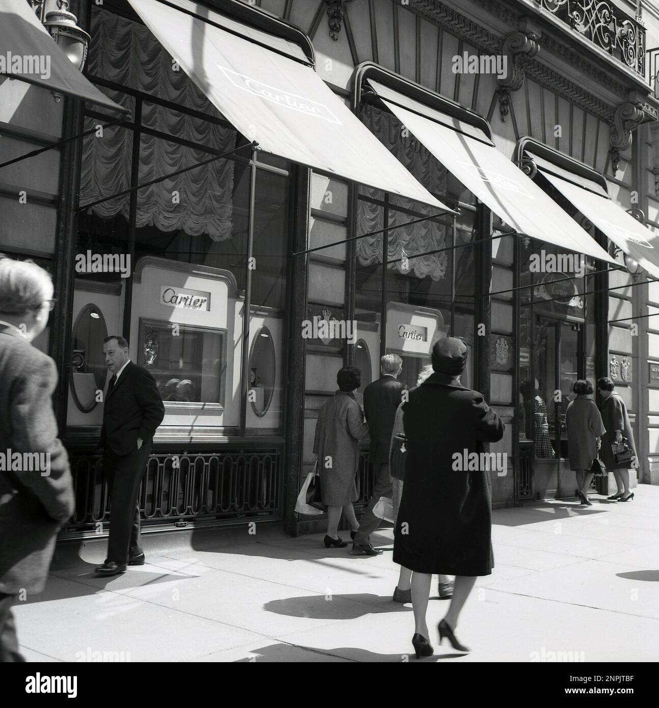 1960s, historical, summertime and people walking underneath the ...