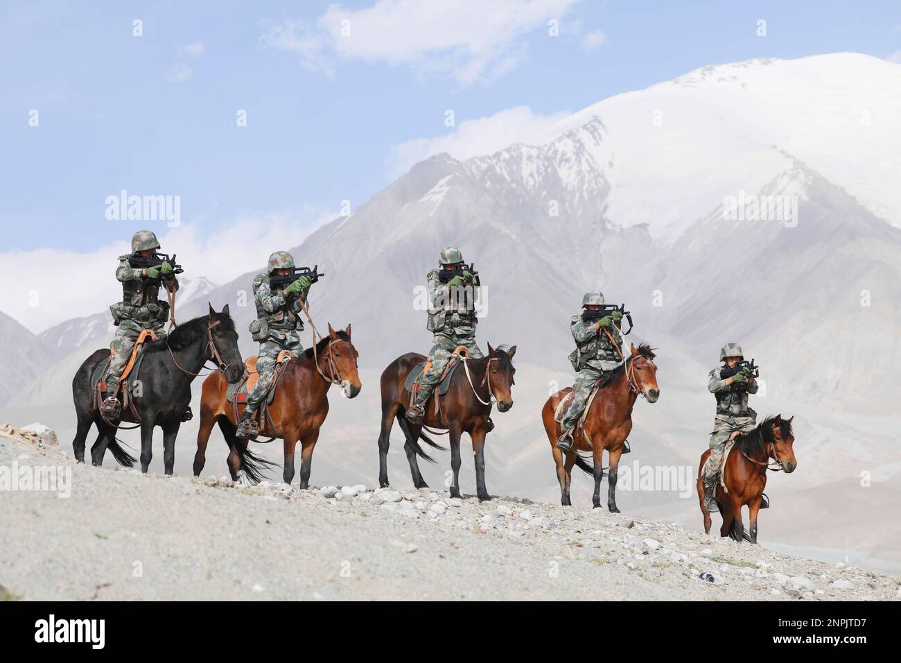 PLA soldiers have a training session on horses on the Pamir Plateau in ...