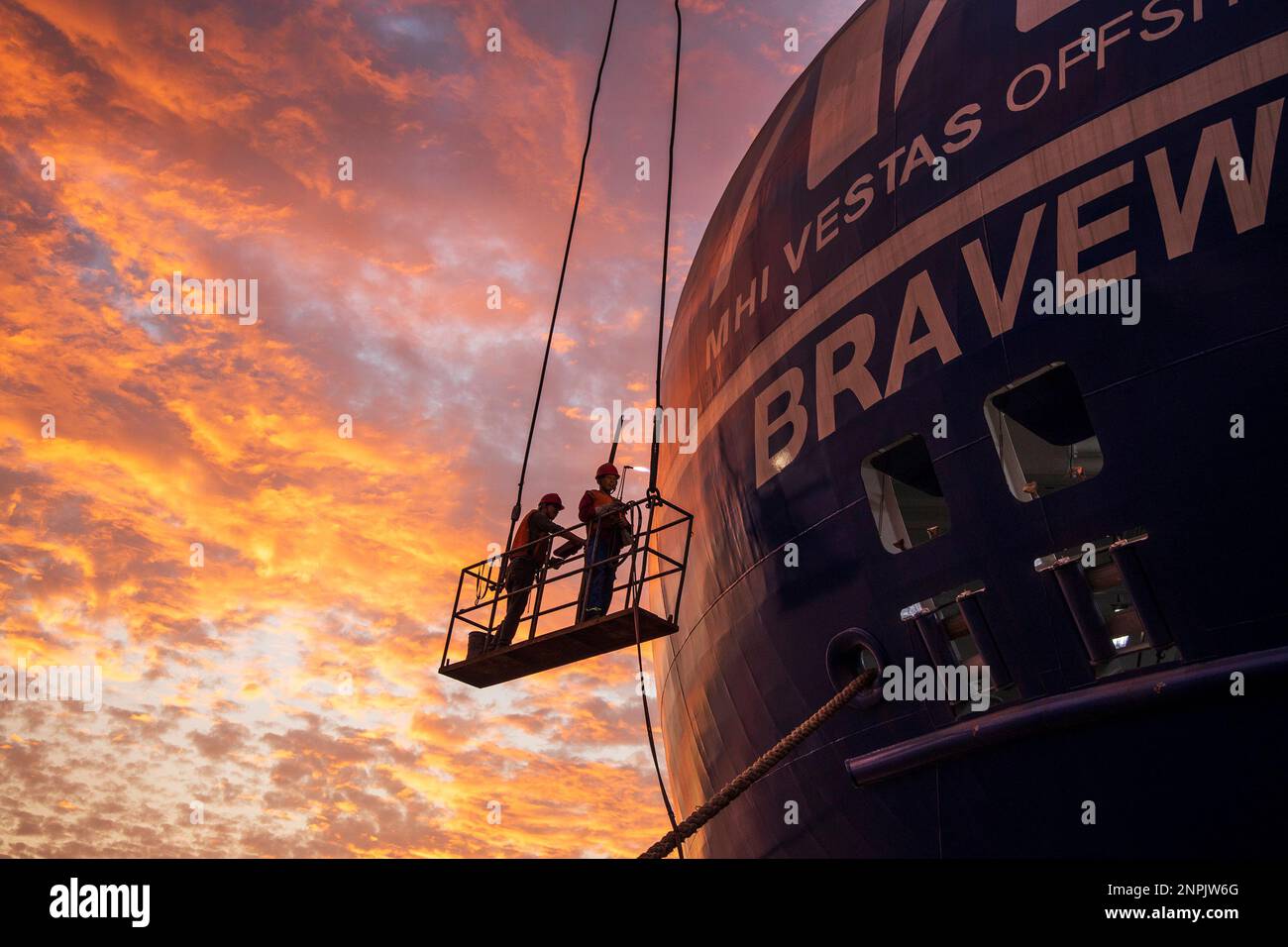 Welders work on the hull of MV BRAVEWIND, the second 10,000 DWT full ...