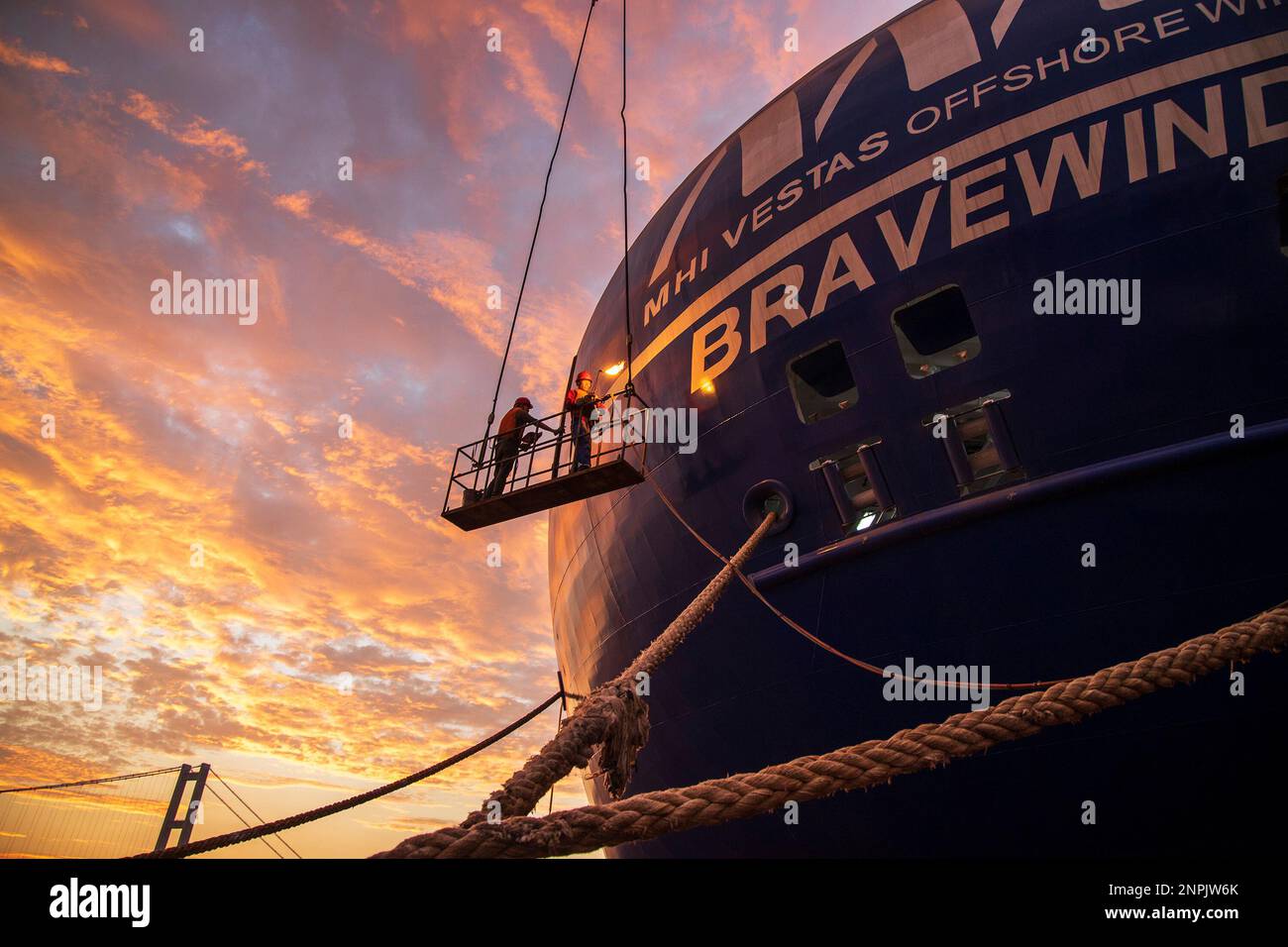 Welders work on the hull of MV BRAVEWIND, the second 10,000 DWT full ...