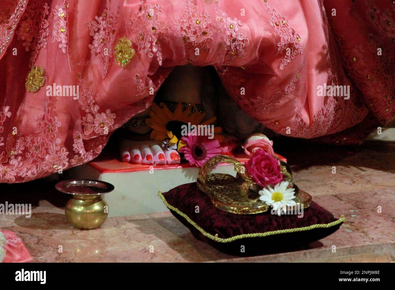 A goddess Srimati Radharani shows her lotus feet during the Radhastami ...