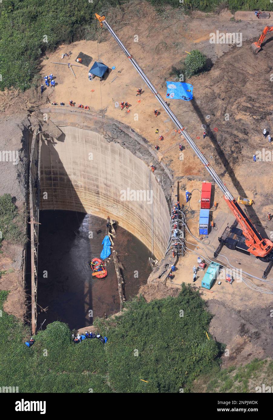 An aerial photo shows the underground oil storage tank remain which ...