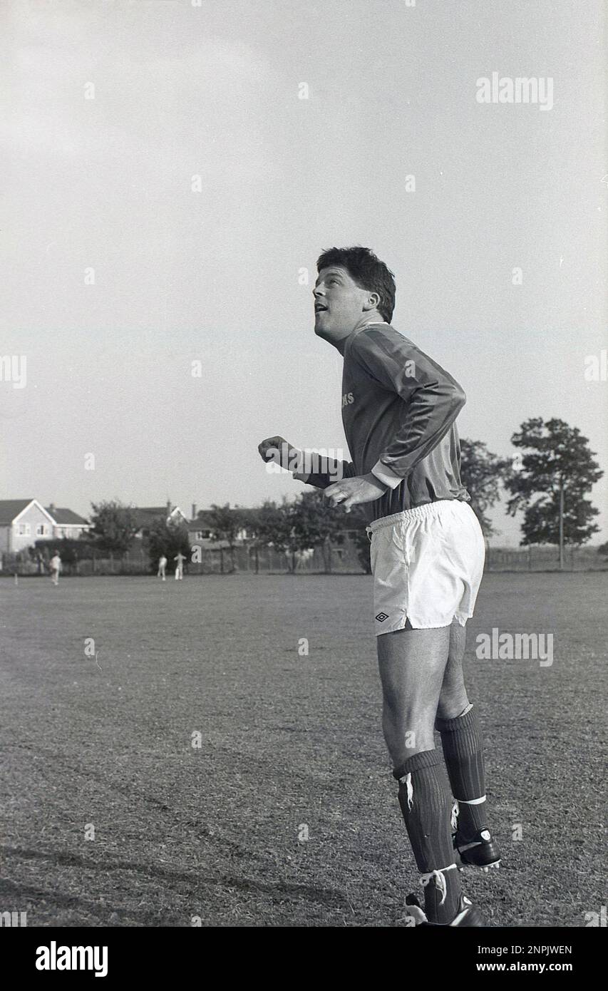 1988, historical, outside on a sports field, a male footballer ...